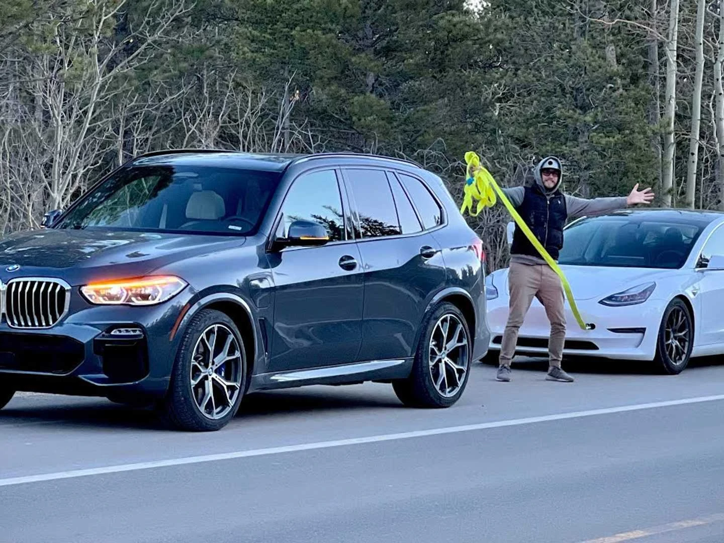 Watch BMW X5 PHEV Rescue Stranded Tesla Model 3 By Tow Charging It