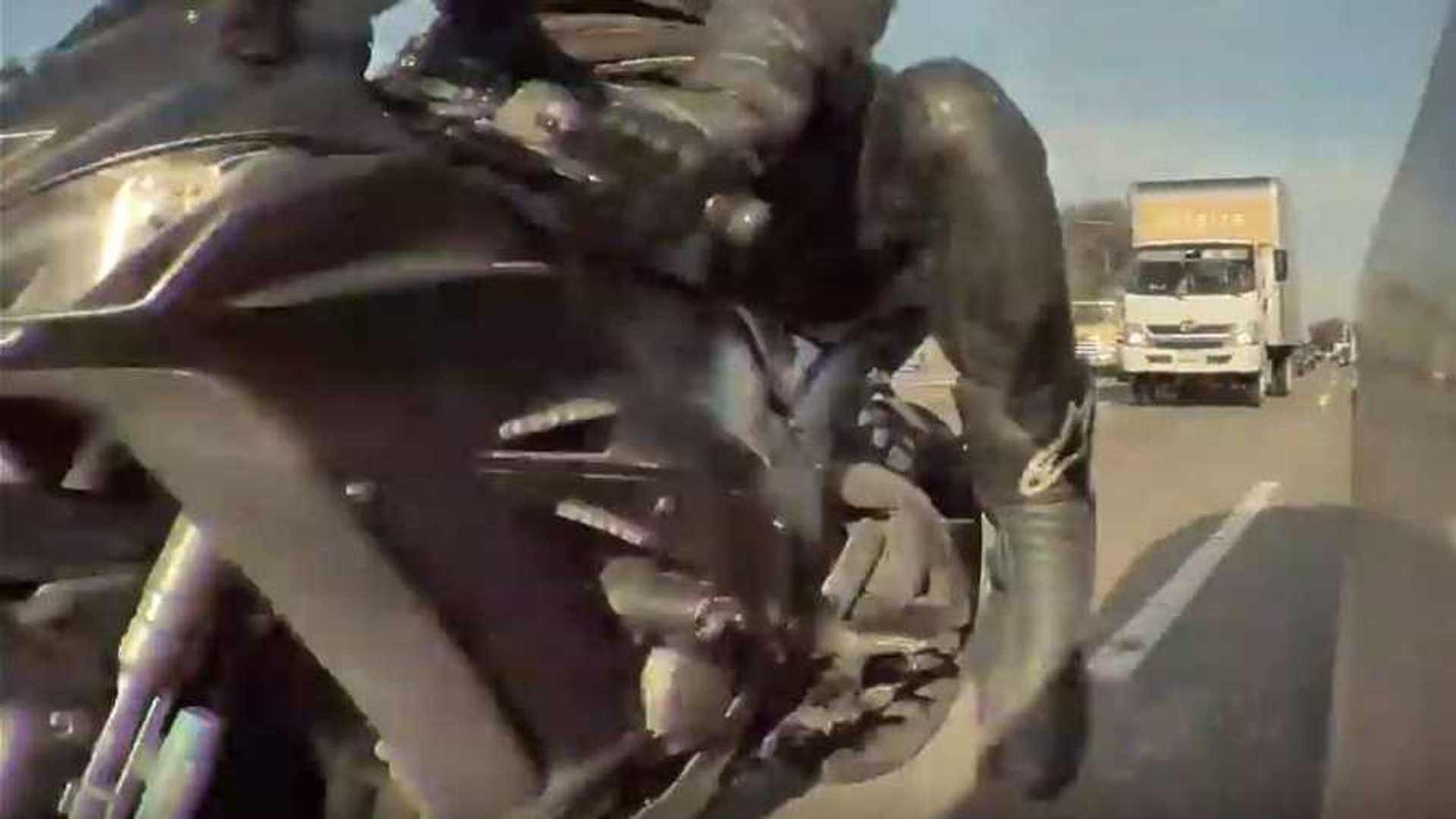 Watch This Motorcyclist Kick A Moving Tesla Model 3