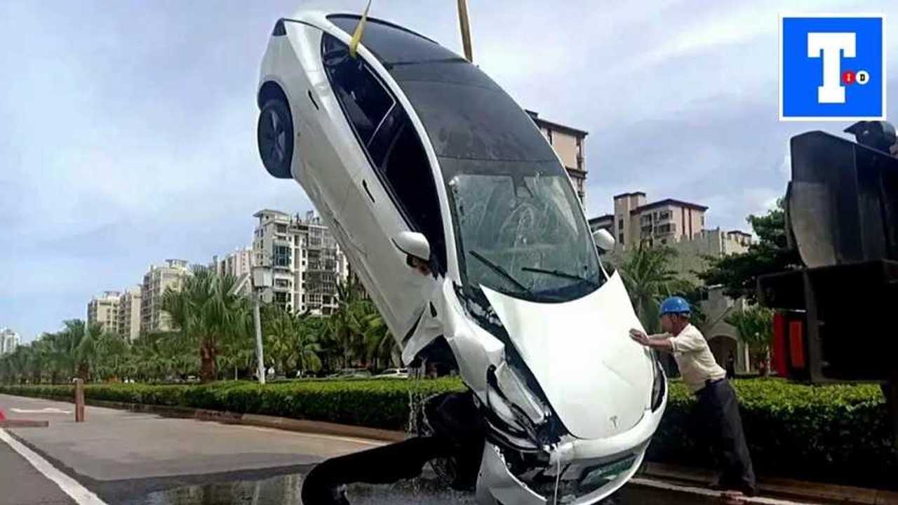 Watch Tesla Crash Through Guardrail In China, Land In A Ditch