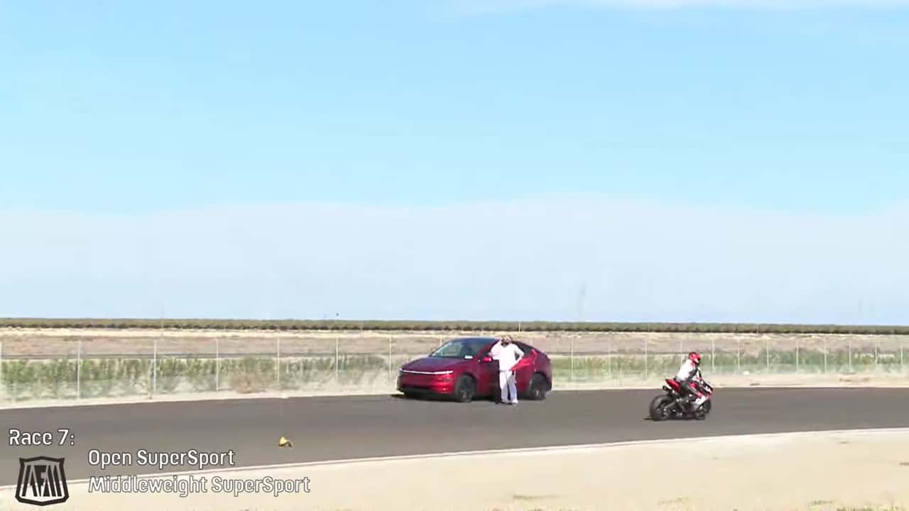 Tesla Drives Onto Live Race Track During Motorcycle Race, as Driver ...