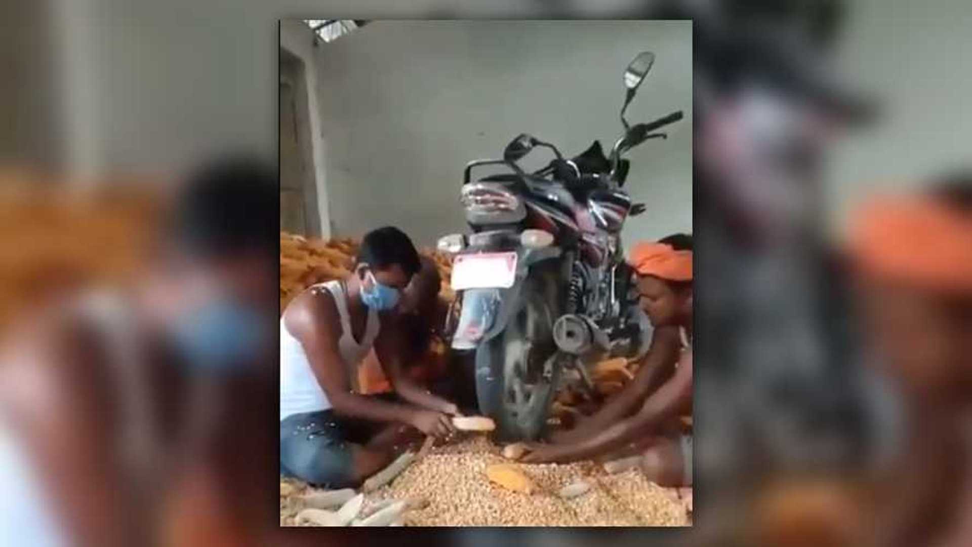 Watch These Indian Farmers Use A Motorcycle To Shell A Bunch Of Corn
