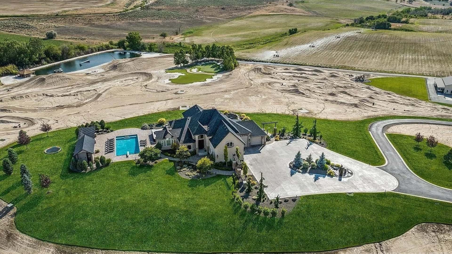 This Massive Home Comes With Its Own Motocross Track, and a Private Lake