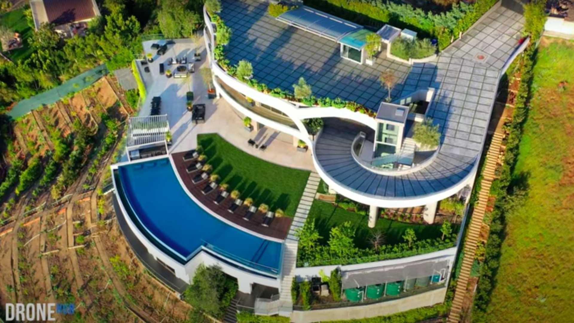 Travis Scott Snaps Up $23.5 Million Mansion with 20-Car Auto Gallery